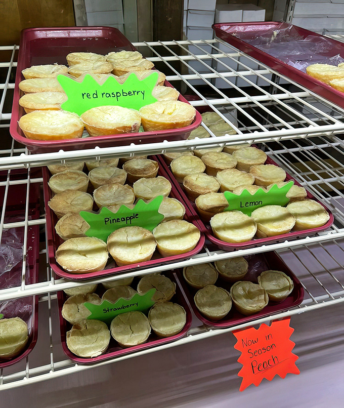 Tiny fruit pies lined up like colorful soldiers&mdash;red raspberry, pineapple, lemon, and seasonal peach&mdash;each one a perfect personal indulgence.