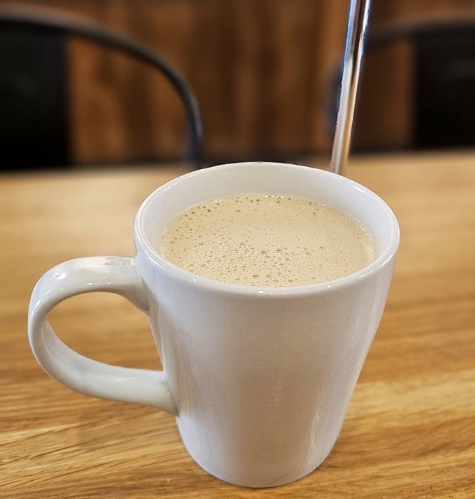 Steam rises from a perfectly crafted latte, the foam creating a temporary canvas that's almost too pretty to disturb with your first sip.