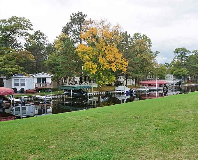 The marina's peaceful morning reflection could convert even the most dedicated city-dweller into a lake life enthusiast.