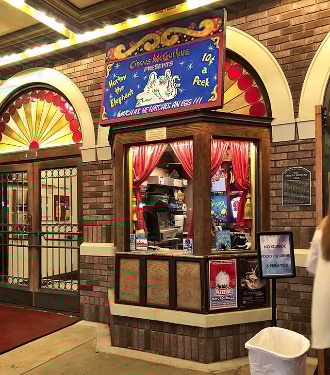 The charming ticket booth harkens back to simpler times, when ten cents bought a peek at wonders that would be remembered for a lifetime.