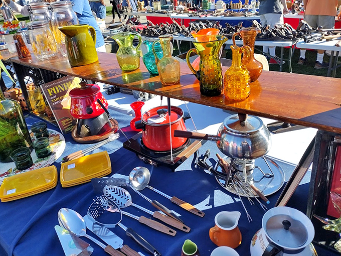 Colorful vintage glassware catches the morning sun, turning ordinary tables into jewel-toned treasure displays.