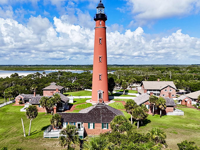 Bird's-eye brilliance! The lighthouse complex spreads out like a historical village, each building playing a supporting role to the towering brick star of the show.
