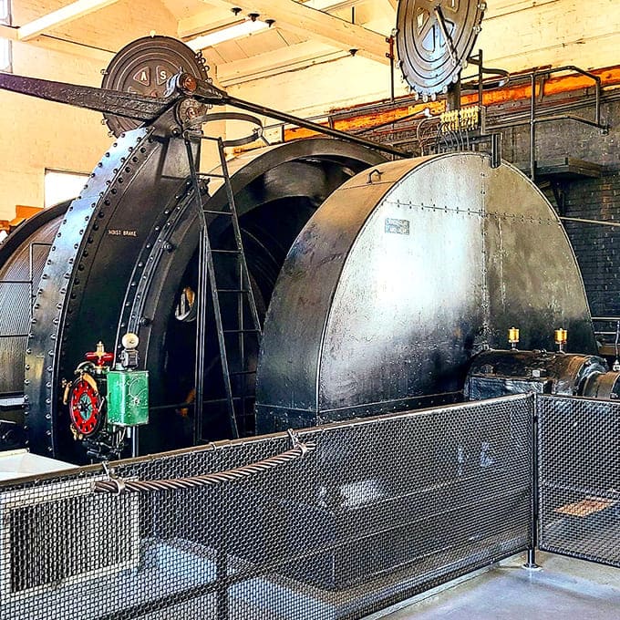 Mechanical marvel: This massive hoisting engine, with its gleaming brass and imposing flywheels, literally held miners' lives in its gears.