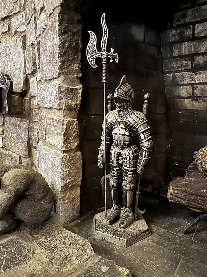 Even the smallest details maintain the medieval theme – this knight stands eternal guard by the fireplace, ready for service.