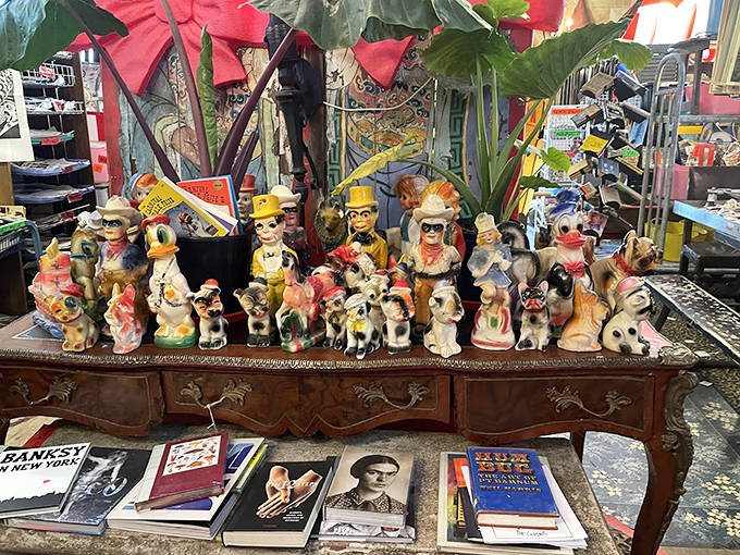 This whimsical collection of vintage figurines seems to be having its own little party on an antique table &ndash; characters frozen in mid-conversation for decades.