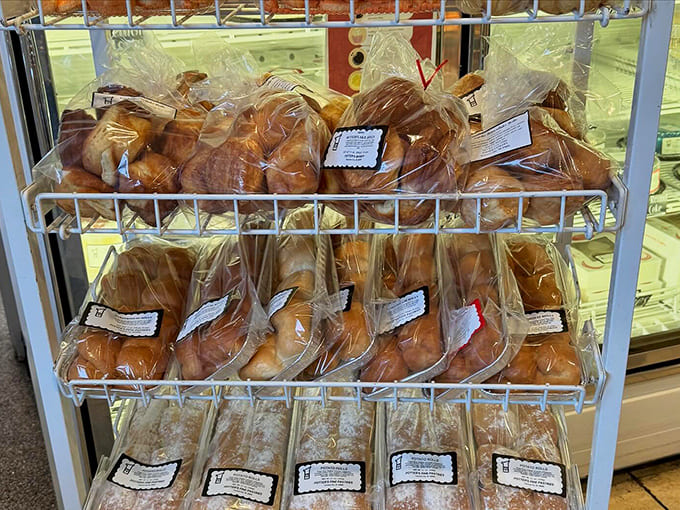 Packaged pastries ready to go home with lucky customers, wrapped up like sweet presents you're giving to yourself because you deserve it.