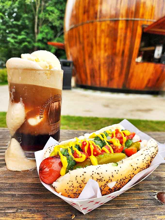 The perfect pairing: a classic hot dog alongside the barrel's signature root beer &ndash; sometimes the simplest combinations are the most satisfying.