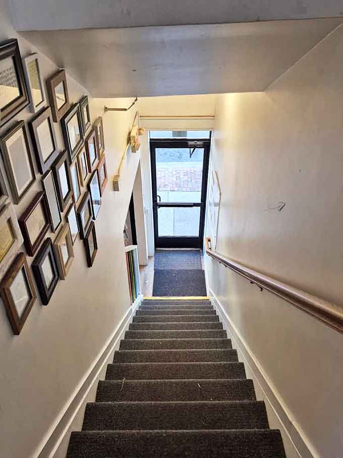 The stairway to the basement serves as a gallery of literary history, each step taking you further from everyday life into book-lover's bliss.