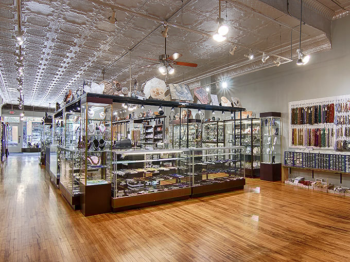 Polished wooden floors and gleaming display cases create a treasure-cave atmosphere that makes every discovery feel significant.