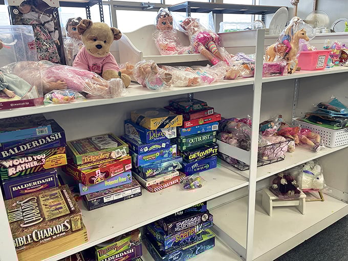 Board games with all pieces intact (a miracle!) sit alongside plush toys waiting for their next cuddle.