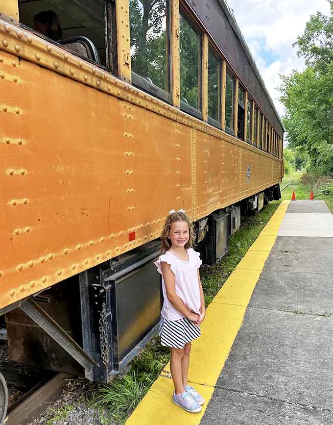 Future train engineer in training? This young rail fan discovers the massive scale of vintage railcars, where every rivet tells a story.