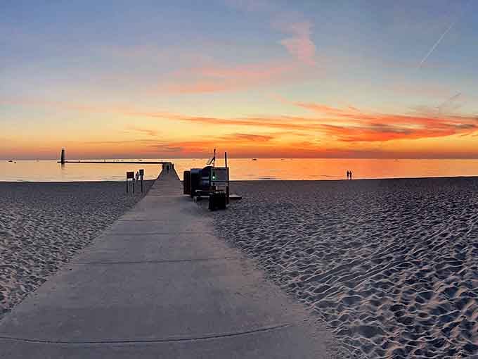 Board Walk: Sunset transforms the pier into a golden pathway, leading visitors toward the horizon as day gracefully surrenders to evening.