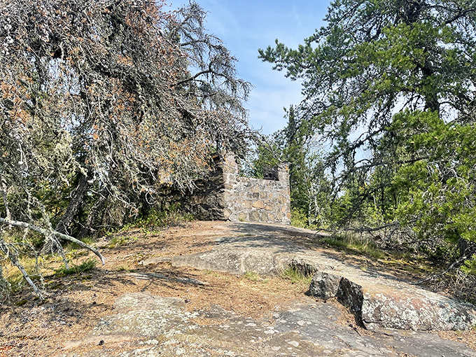 Stone remnants of the old fire tower stand as silent sentinels, whispering tales of forest guardians who once watched for smoke signals.