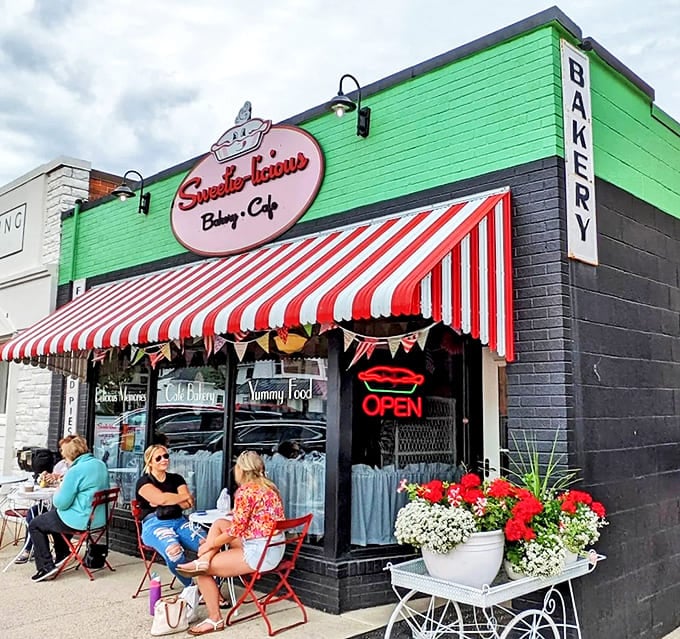 Sweetie-licious's eye-catching green exterior with red-and-white striped awning promises a whimsical experience inside.