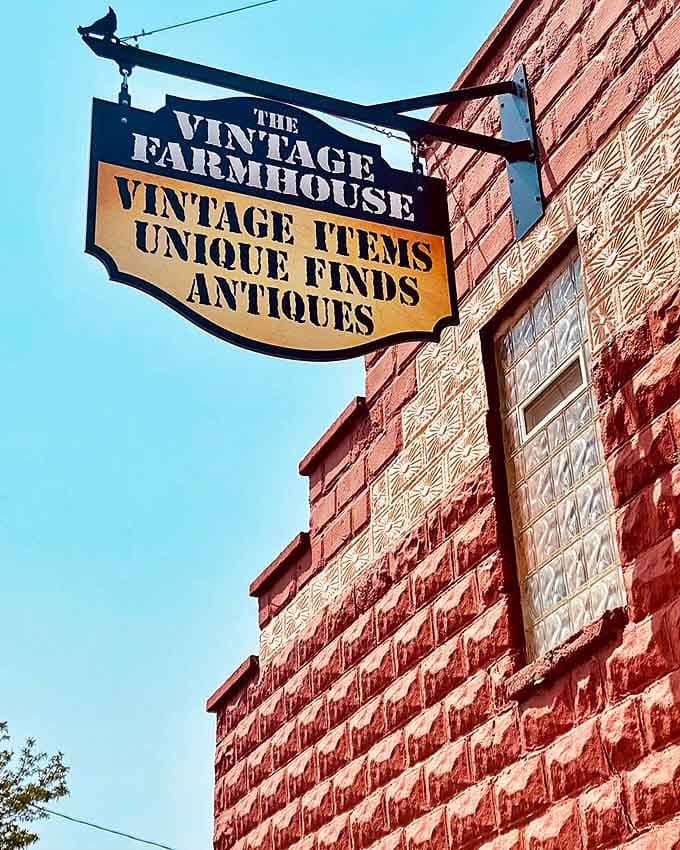 The Vintage Farmhouse's charming sign extends an invitation to explore a world of carefully curated antiques and farmhouse treasures.