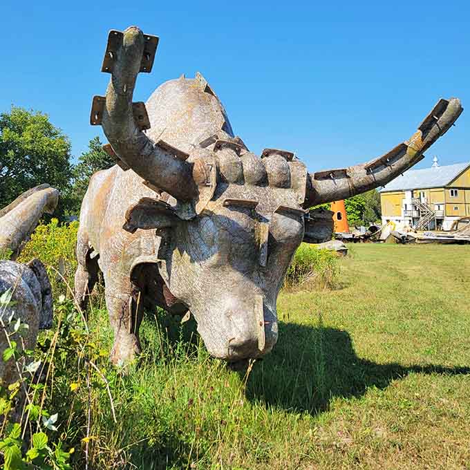 Massive fiberglass animal forms rest in the grass at the FAST Fiberglass Mold Graveyard, creating an otherworldly sculpture garden of retired molds.
