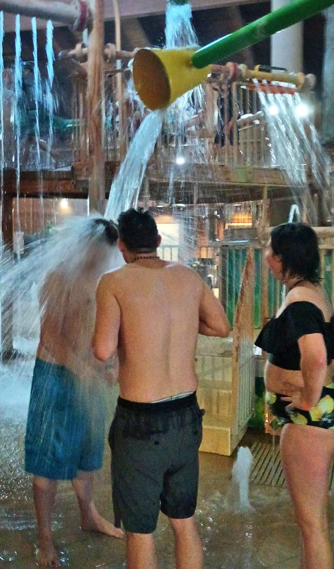 Adults discover that playing in water knows no age limit as this ingenious shower contraption brings out everyone's inner child.