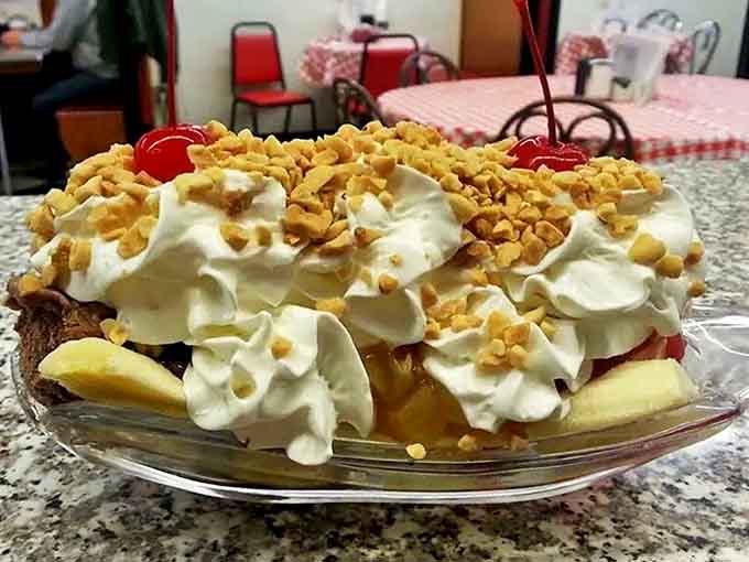 This banana split isn't just dessert, it's a commitment – with twin peaks of whipped cream standing guard over fruit and ice cream.