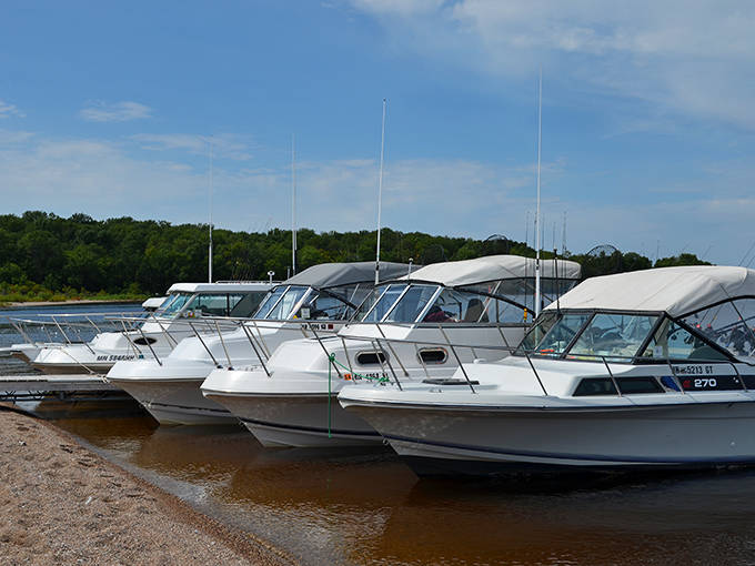 A flotilla of boats rests along the shore, each representing someone wise enough to seek out this hidden paradise.