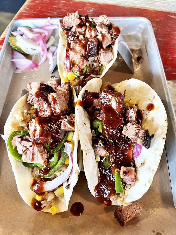 Brisket tacos &ndash; where Texas meets Mexico in a hand-held flavor fiesta topped with fresh vegetables.