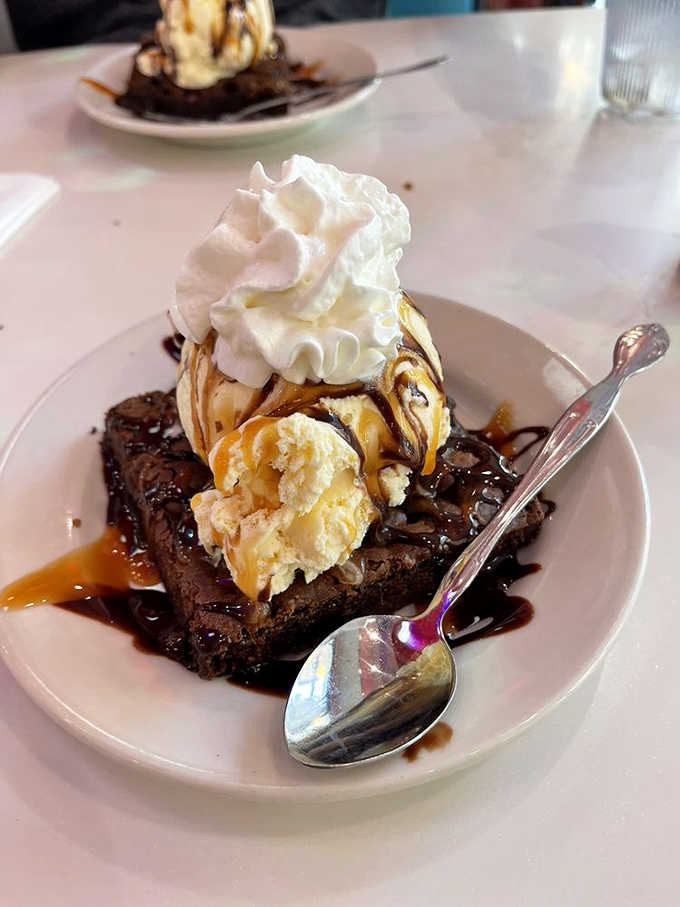 This brownie delight towers like a delicious monument to the concept that more is definitely more when dessert's involved.