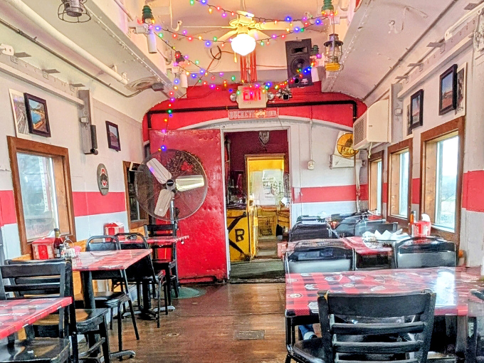 Inside the Buckeye Express Diner, classic red booths and nostalgic decor transport diners to a simpler time of rail travel.