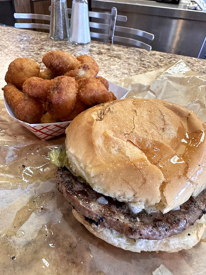 The Butter Steak burger with mushrooms showcases Wisconsin's signature burger style. That glistening patty has been kissed by both fire and butter.