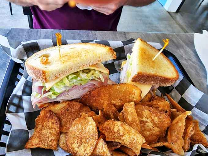 This towering sandwich achievement comes with house-made chips that'll ruin store-bought versions for you forever.