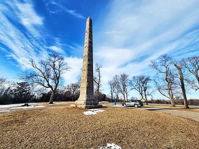 Camp Release Monument rises dramatically against the winter sky, a silent witness to pivotal moments in Minnesota's complex history.