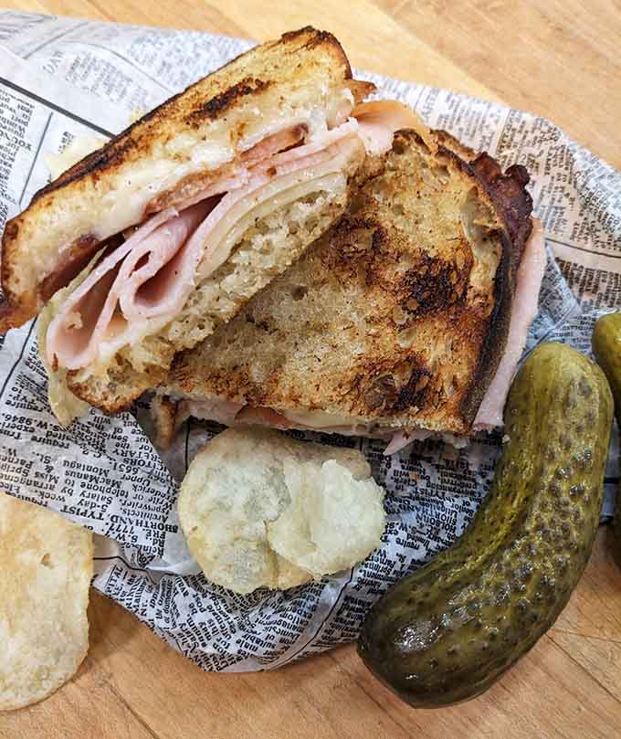 This sandwich on artisan bread with pickles is basically a hug between two slices, and yes, you deserve that hug today.