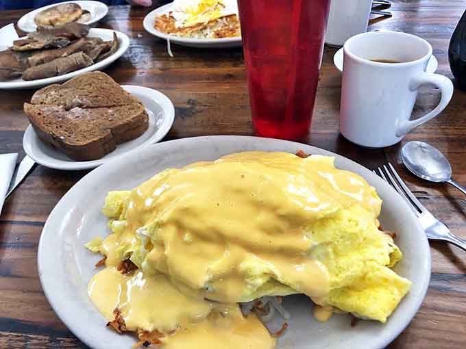 The Cheddar Cheese Skillet sizzles with promise &ndash; a bubbling landscape of potatoes, eggs, and melted cheese that requires both a fork and a moment of silent appreciation.