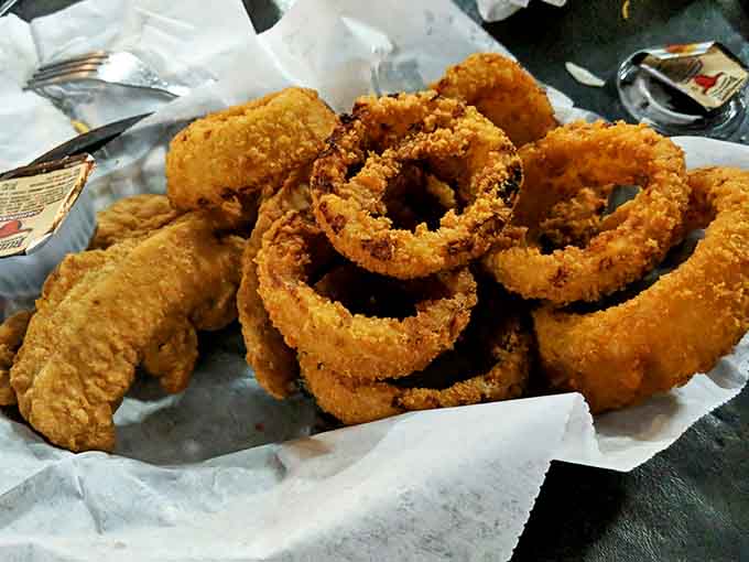 Golden-brown chicken strips and onion rings arrive crispy on the outside, tender within, ready to vanquish even the mightiest hunger.