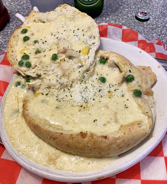 This chicken pot pie breaks through its golden crust to reveal a steaming interior that's the edible equivalent of a warm hug.