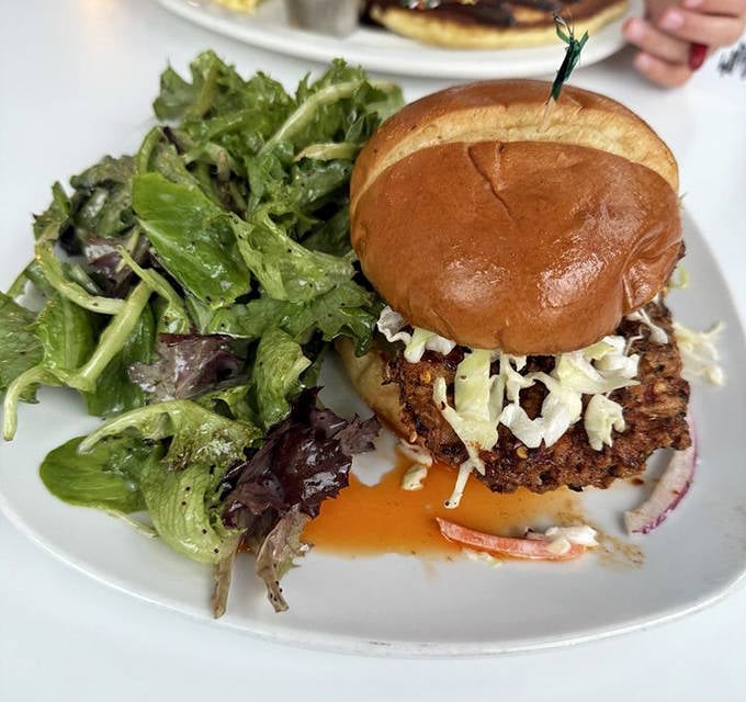 A masterclass in sandwich engineering – crispy chicken, fresh greens, and the perfect bun-to-filling ratio that makes you wonder why yours at home never look like this.