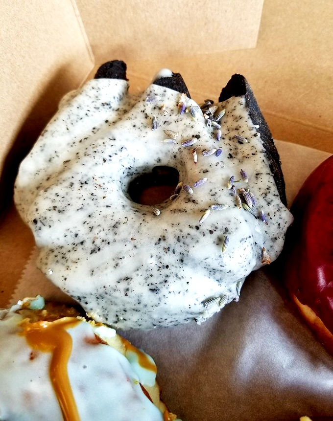 The sophisticated Chocolate Earl Grey donut, where tea meets sweet in a bergamot-infused glaze that transforms chocolate into something unexpectedly refined.