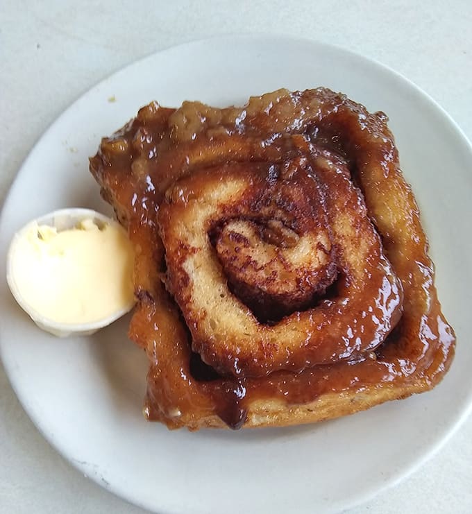 The cinnamon roll &ndash; a spiral of sweet defiance against boring breakfasts everywhere, with butter melting into every warm, spiced crevice.