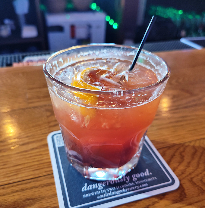 A craft cocktail that complements the pickle-forward menu, proving that even your beverage can get in on the briny brilliance.