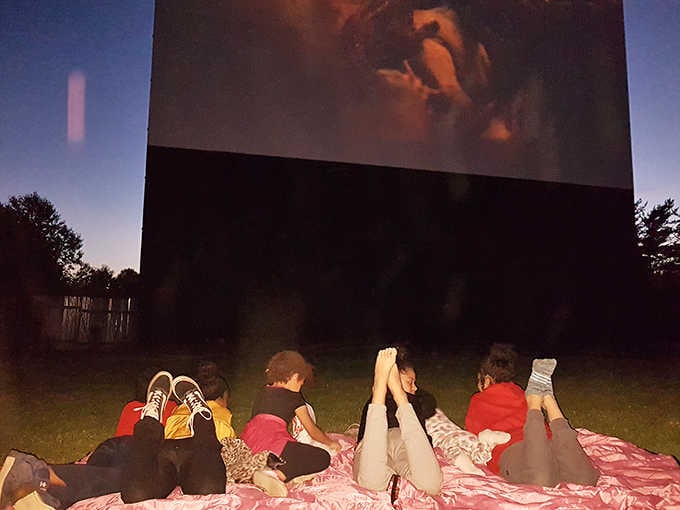 The ultimate bedroom upgrade &ndash; blankets, pillows, and a teddy bear transform a truck bed into the coziest theater seats in town.