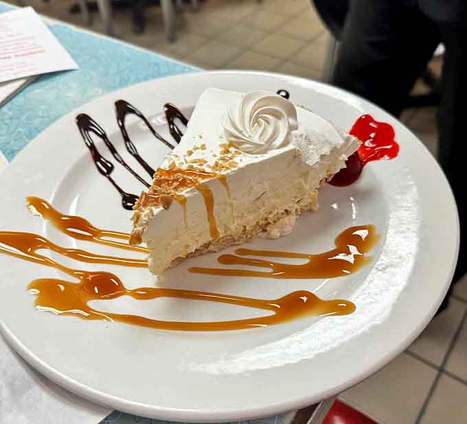 A slice of heaven with whipped cream clouds and caramel rivers &ndash; this isn't just dessert, it's an edible work of art.