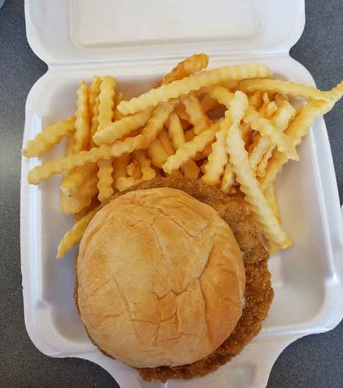 A breaded chicken sandwich with fries demonstrates that Dairyland understands the universal appeal of fried things on bread with more fried things.