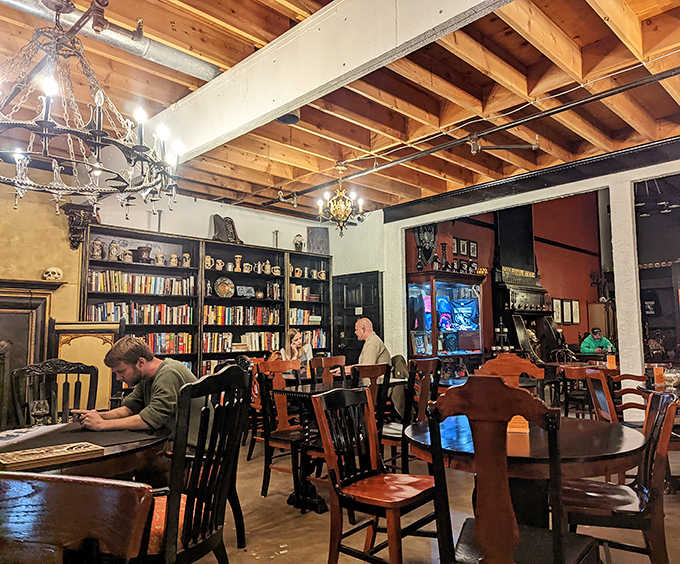 Patrons lose themselves in books and conversation while wooden beams and chandeliers create an atmosphere that's equal parts tavern and royal library.
