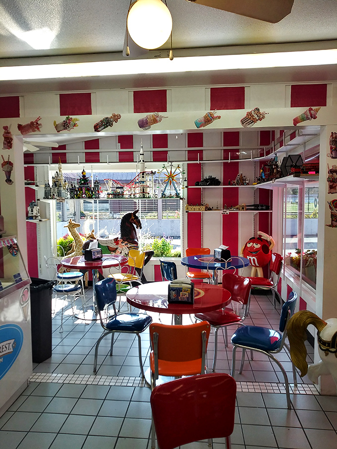 The retro dining area looks like it was plucked from a 1950s soda fountain, complete with candy-striped walls and childhood nostalgia.