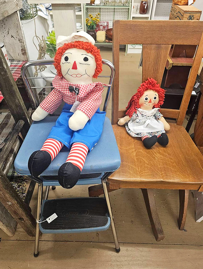 Classic Raggedy Ann and Andy dolls sit patiently waiting for new homes, their stitched smiles unchanged by decades of toy trends.