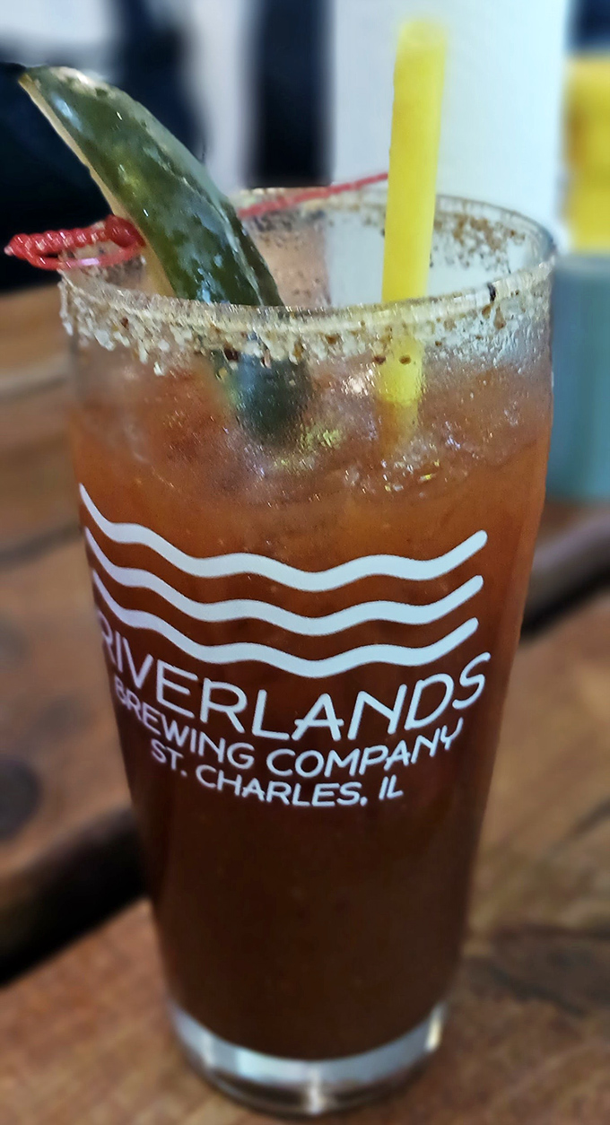 The Bloody Mary arrives like a liquid meal, garnished with enough accessories to qualify as both beverage and appetizer.