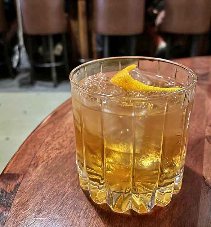 An amber-hued cocktail with a twist of lemon &ndash; the perfect companion to cut through rich, smoky barbecue flavors.