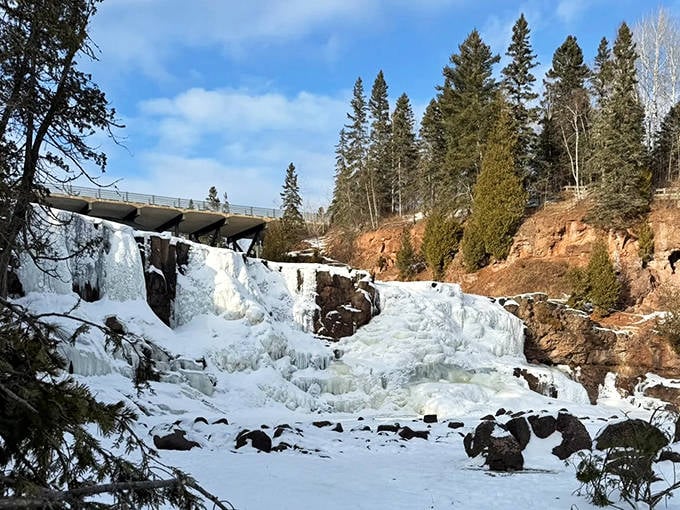 Winter transforms Fifth Falls into a frozen wonderland, where rushing water becomes suspended in time like nature's own glass sculpture exhibition.