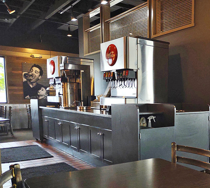 The soda station stands ready to complement your burger adventure. Because every epic meal deserves the perfect beverage companion.