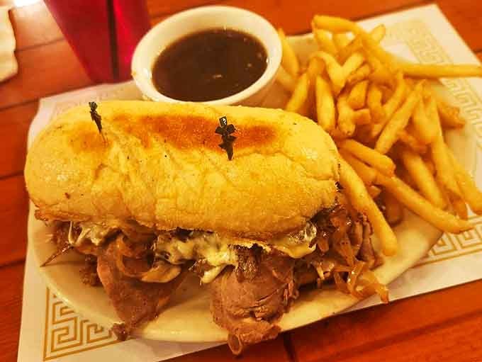The French Dip sandwich arrives with golden fries and savory au jus for dipping. Simple pleasures executed perfectly&mdash;the Brown Bear specialty.