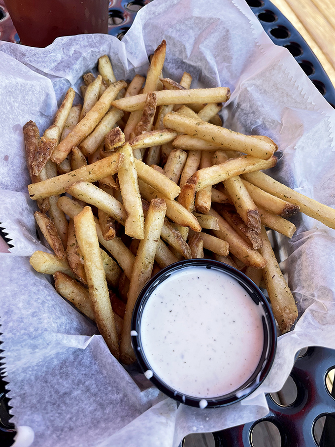 House-cut fries that achieve the perfect balance – crispy exterior, fluffy interior, and seasoned like they graduated from Jedi training.