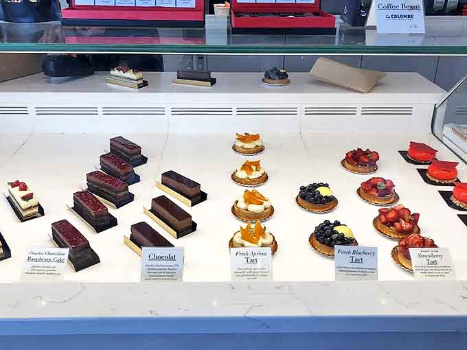 The display case doubles as an art gallery, where fruit-topped tarts compete with chocolate creations for your attention and caloric splurge.